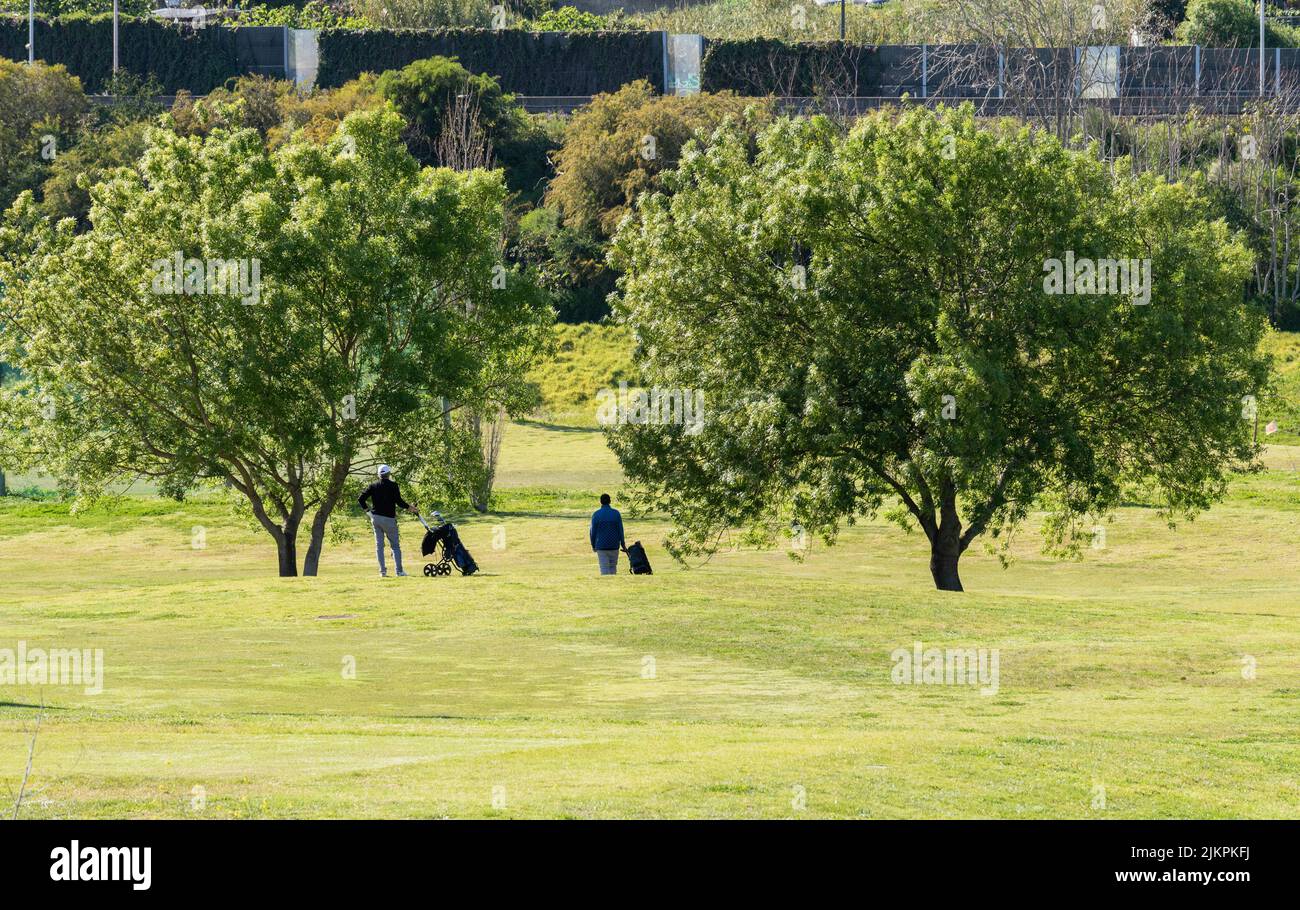 A scenic view of people at the Jamor Golf Course in Lisbon Stock Photo ...