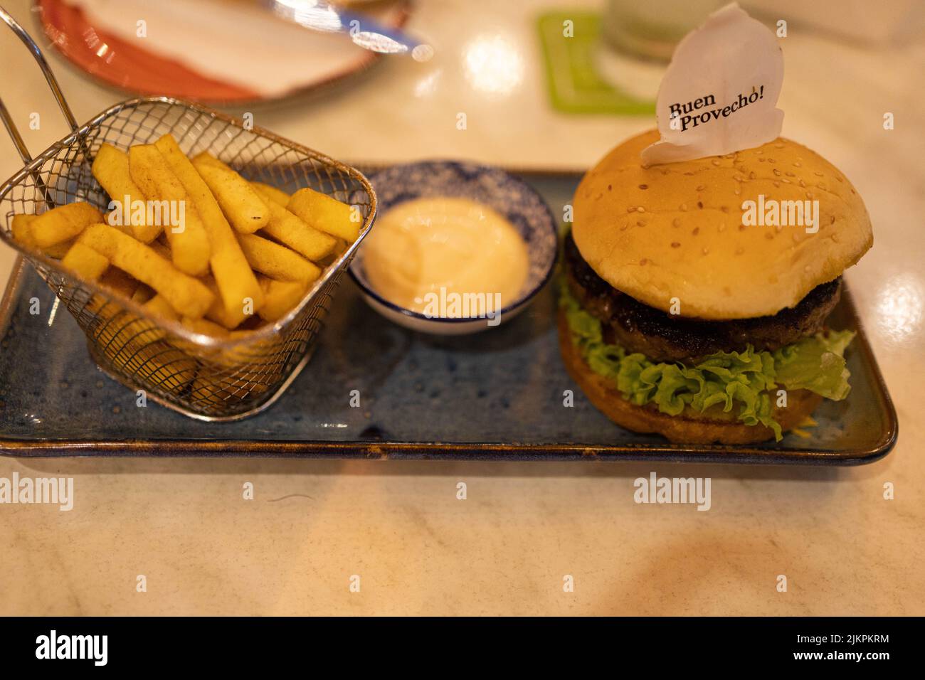 The french fries, sauce, and burger with Bon Appetite text on a plate ...