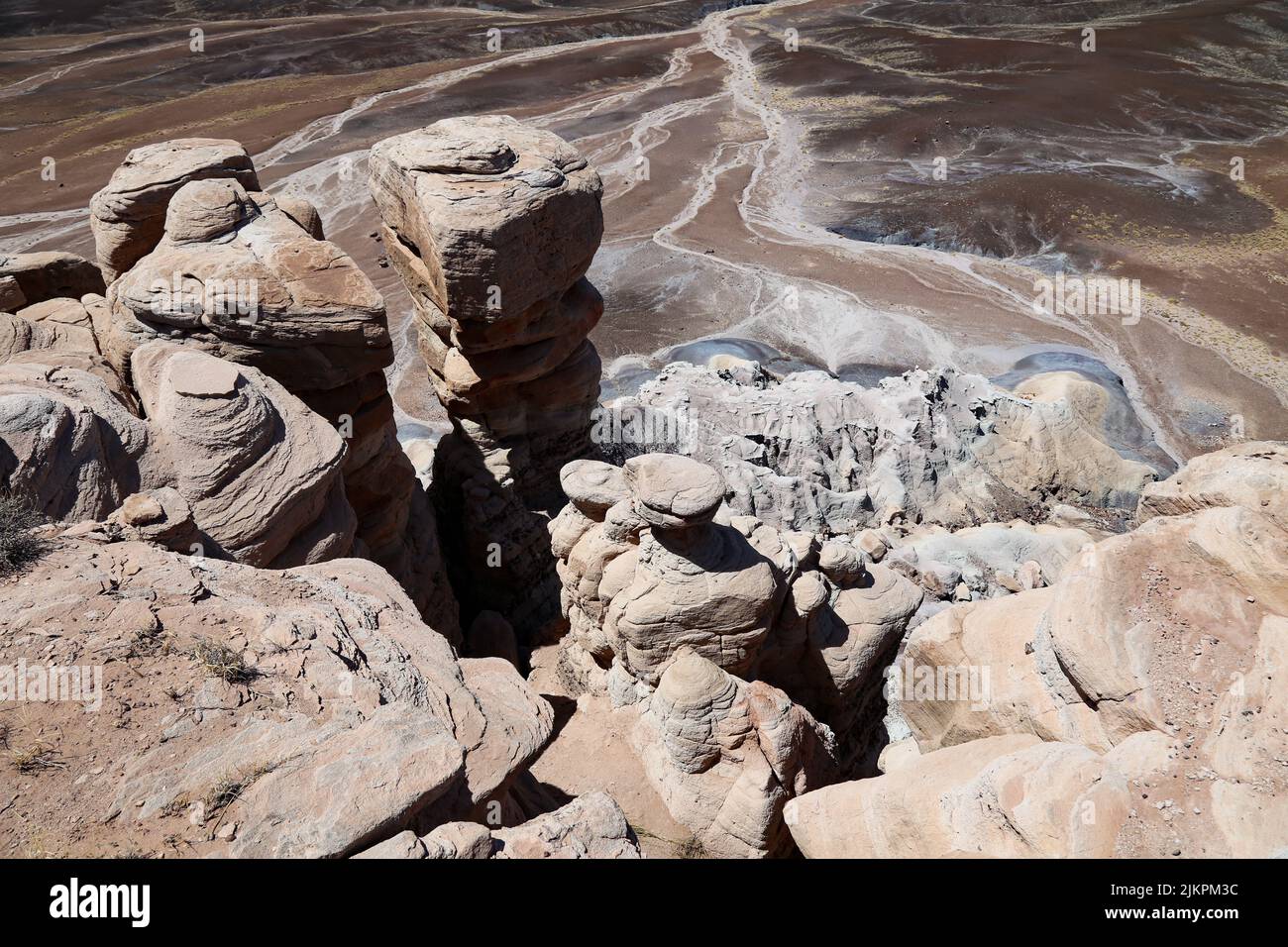 Dry rough rock formations in a desert at Painted Desert National Park ...