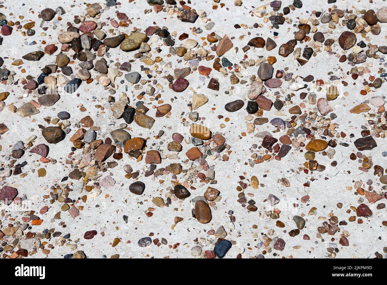 Small colorful pebbles on the ground under the sunlight Stock Photo - Alamy