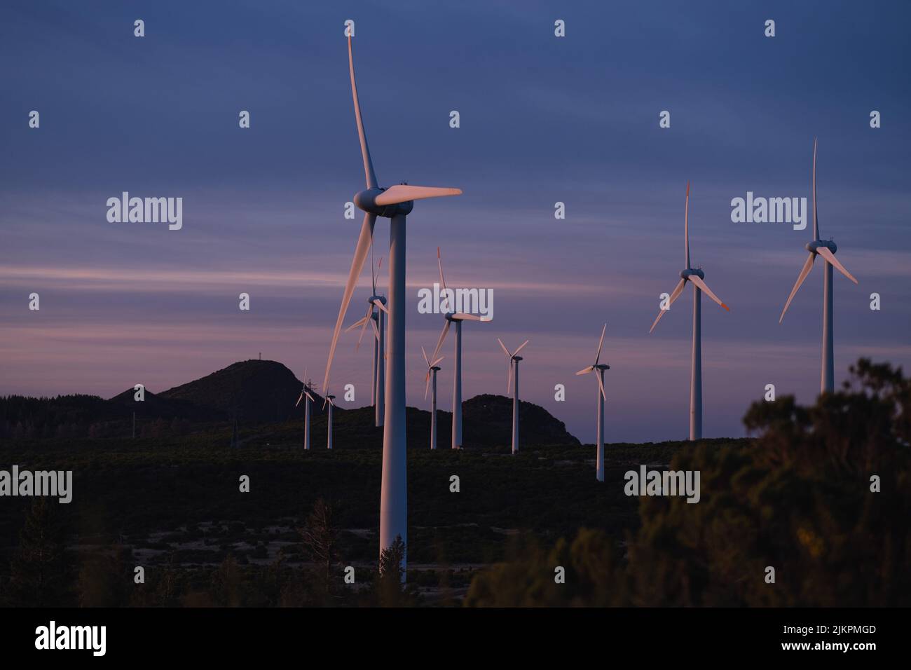 A farm of wind turbines on Madeira Island in Portugal at dusk Stock ...