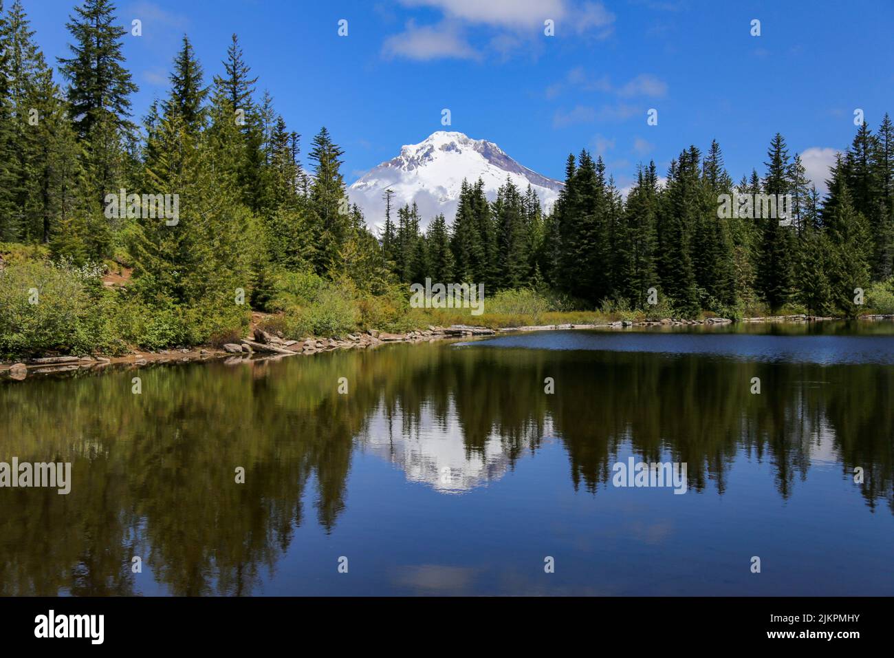 A peaceful scene with the Mount Hood reflected in the Mirror Lake in ... A peaceful scene with the Mount Hood reflected in the Mirror Lake in ...