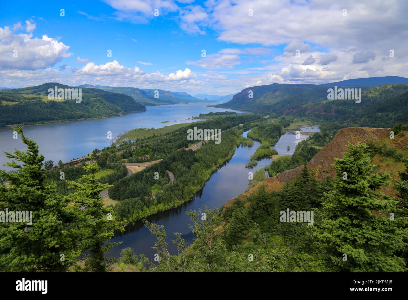 A bird's eye view of lakes surrounded by mountains covered with ...