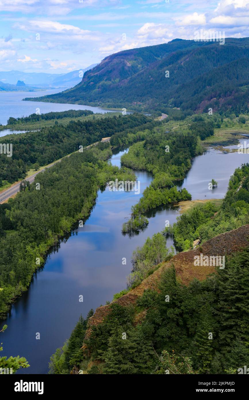 A bird's eye view of lakes surrounded by mountains covered with ...