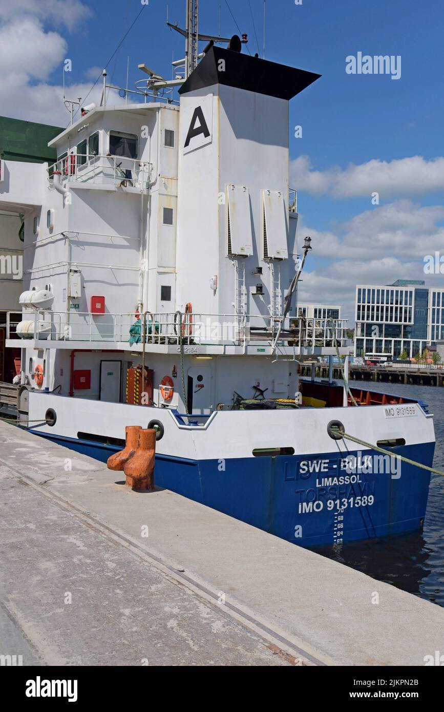 The general cargo ship SWE-BULK loading cargo at the dockside in the ...
