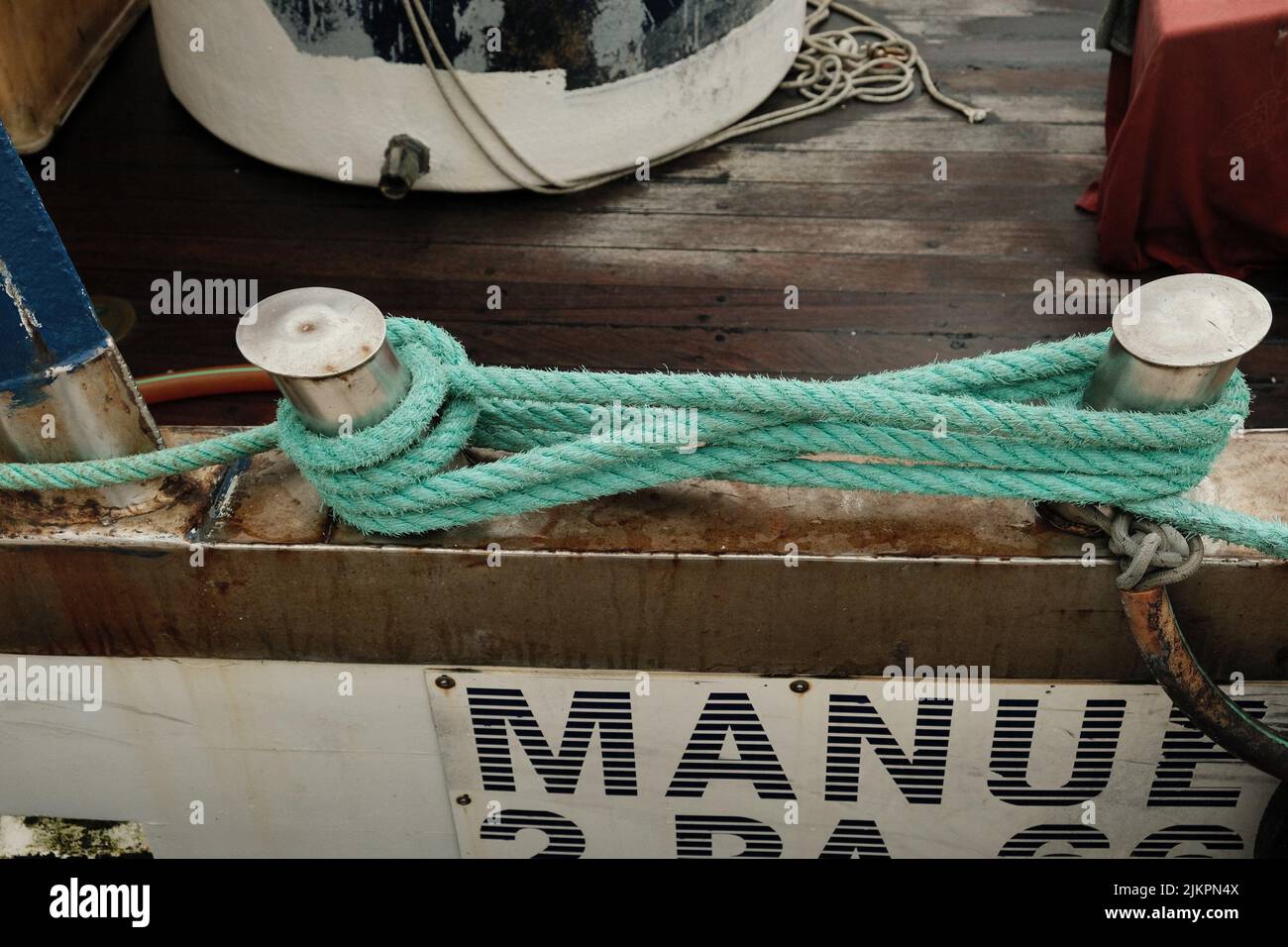 A closeup of mooring ropes on a boat Stock Photo - Alamy