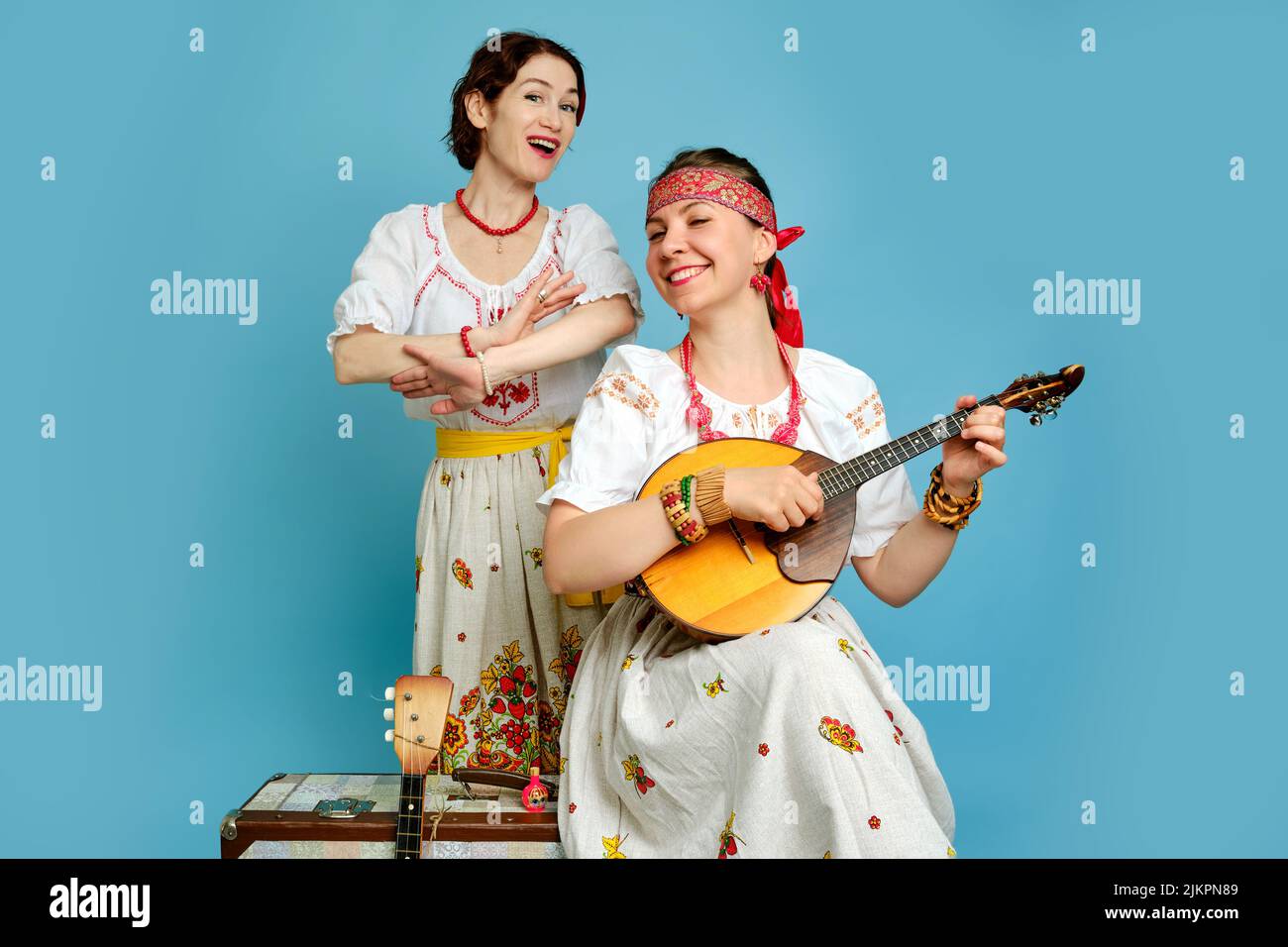 Women musicians in Russian folk dresses with musical instruments on a ...