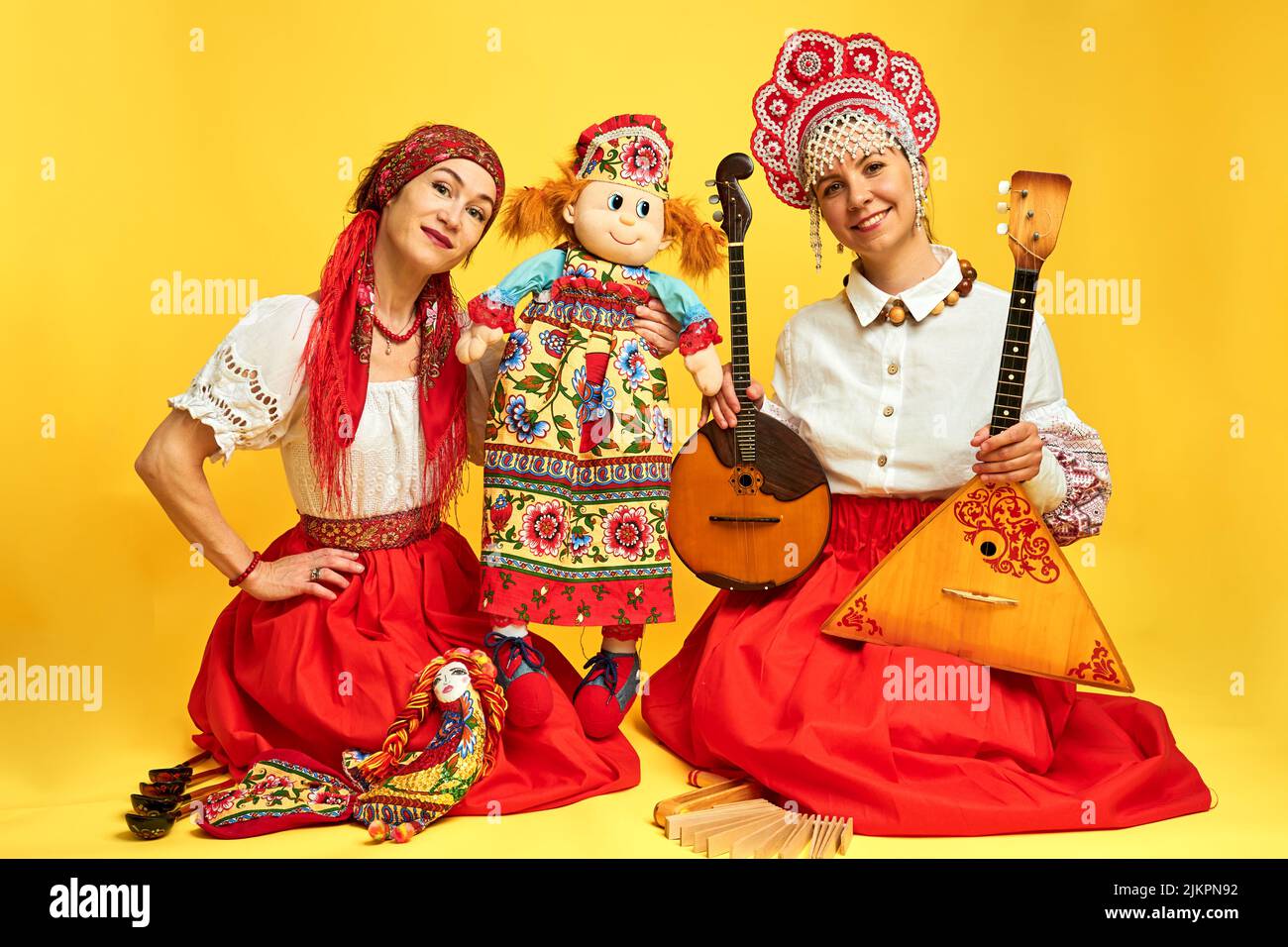 Women musicians in Russian folk dresses with musical instruments on a ...