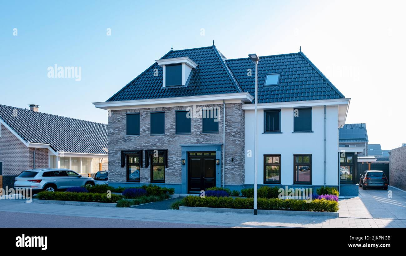 Dutch Suburban area with modern family houses, newly build modern ...