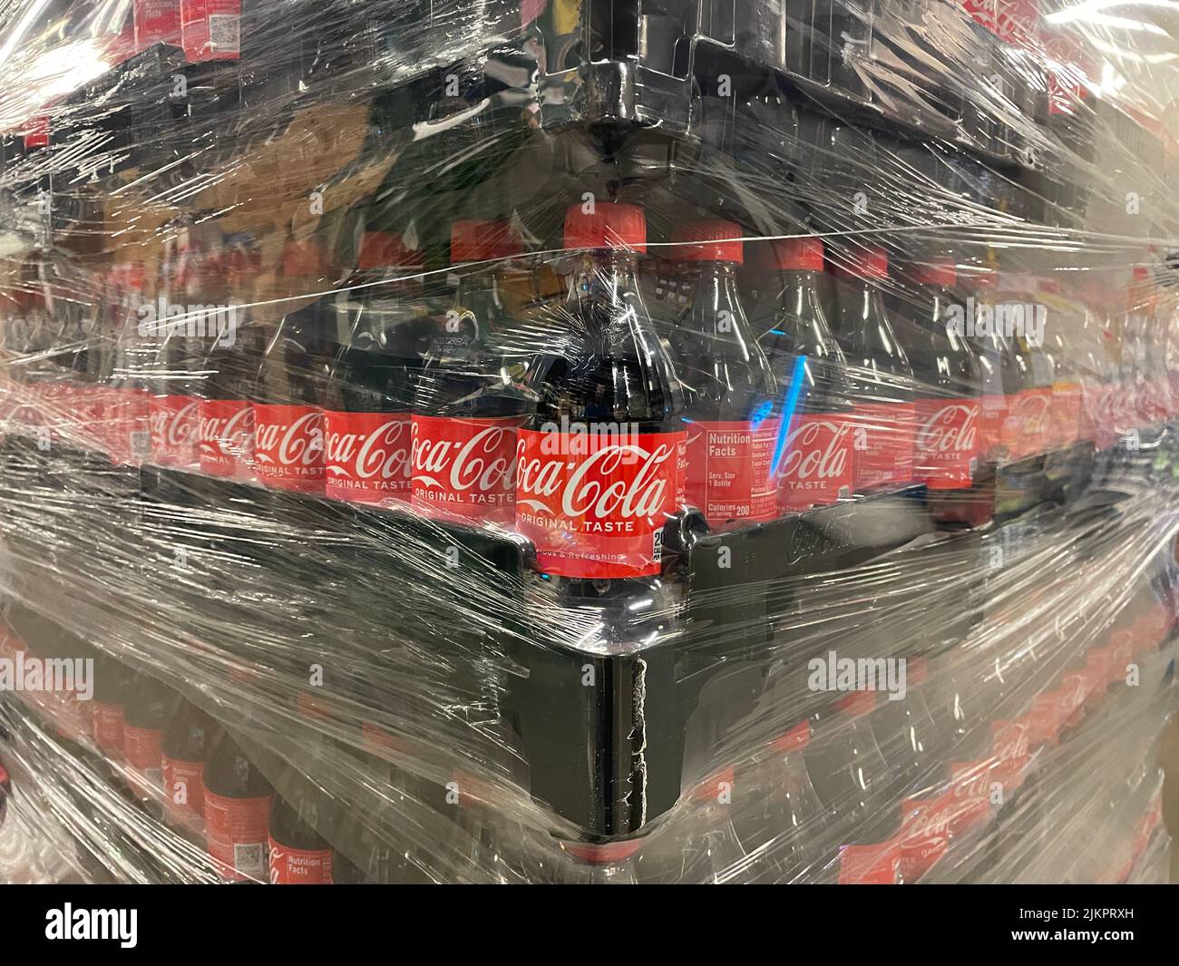 Augusta, Ga USA - 01 14 22: Plastic wrapped Coke pallet in a retail ...