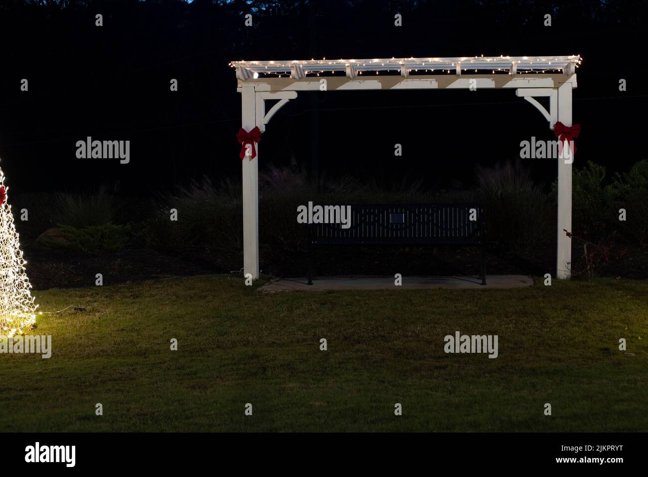 Augusta, Ga USA - 01 14 22: A park bench during Christmas time at night ...