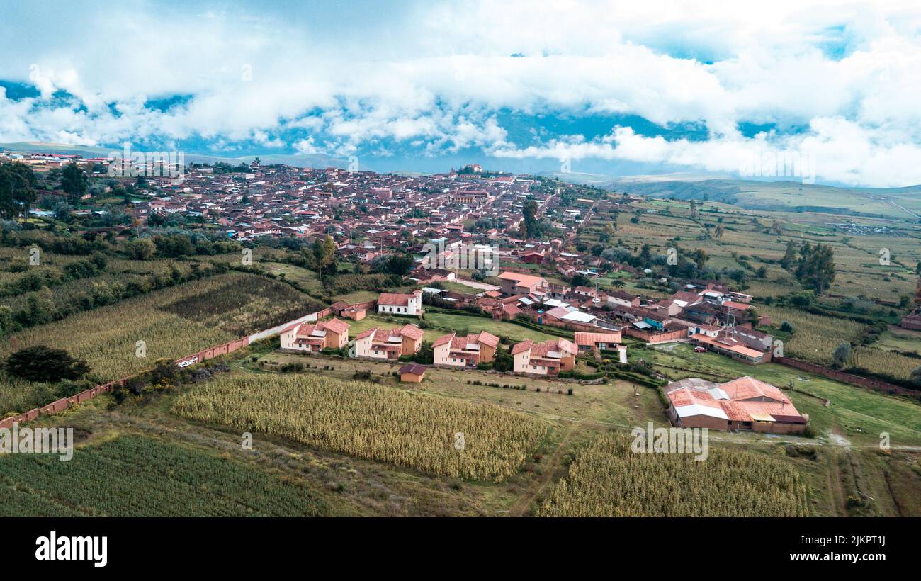An aerial view of farm field and community buildings in Cusco, Peru ...