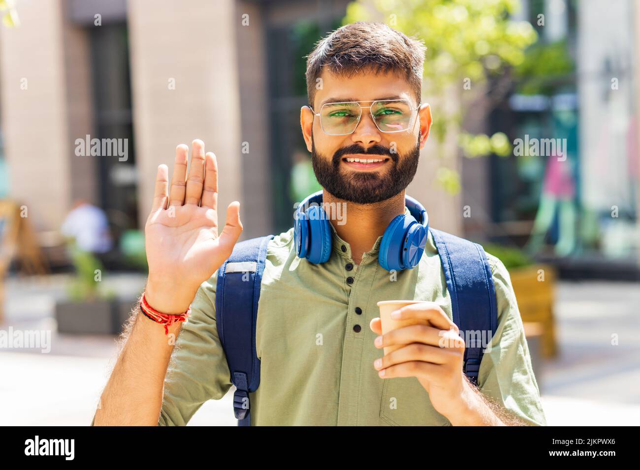 student looking happy and showing friendly gesture outdoors Stock Photo ...