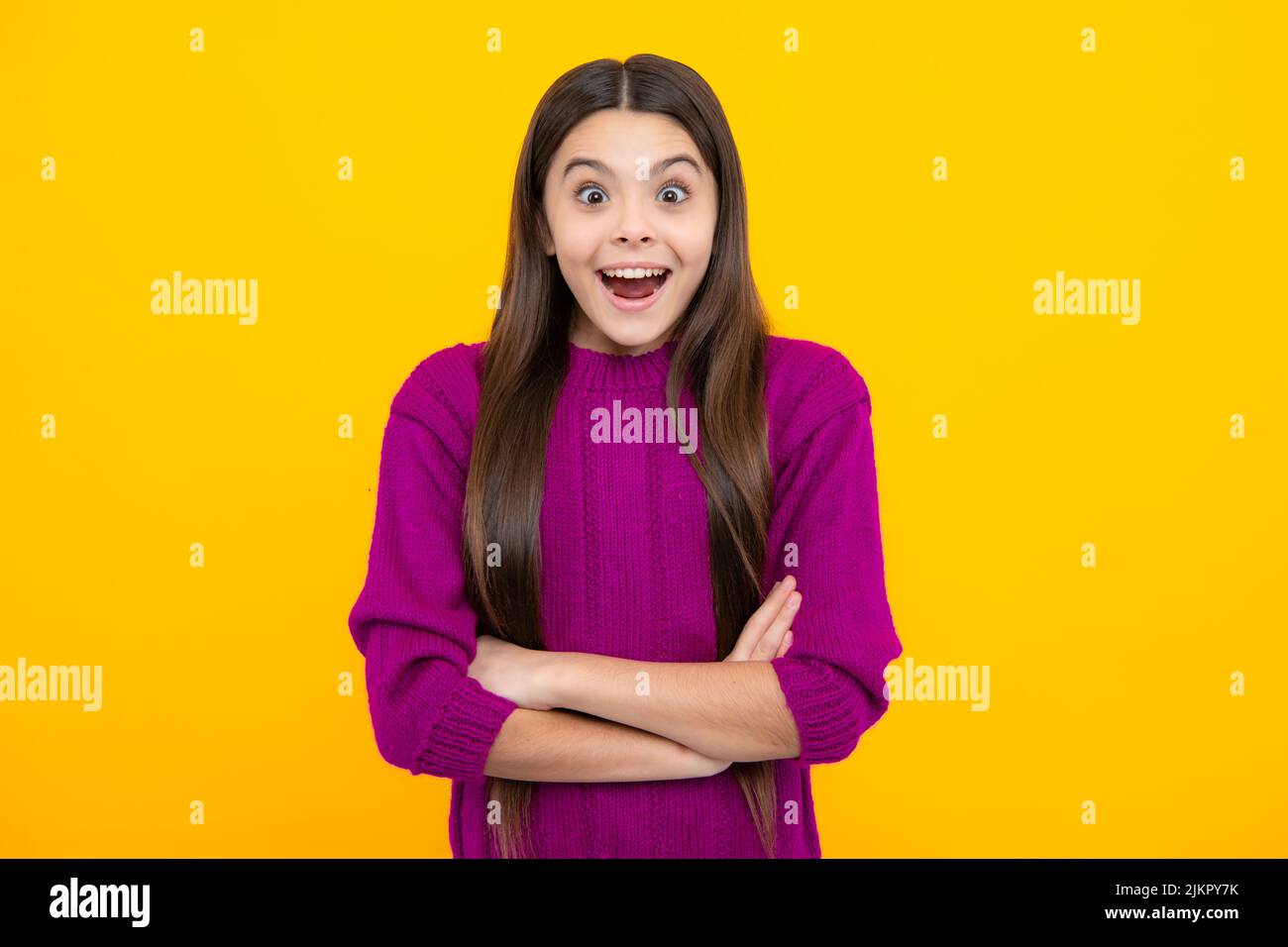 Shocked teenager child with amazed look on yellow background, amazement ...