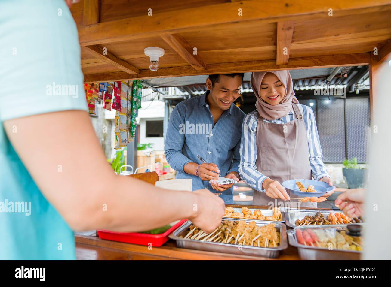 muslim couple enjoy having iftar dinner at traditional food stall Stock ...
