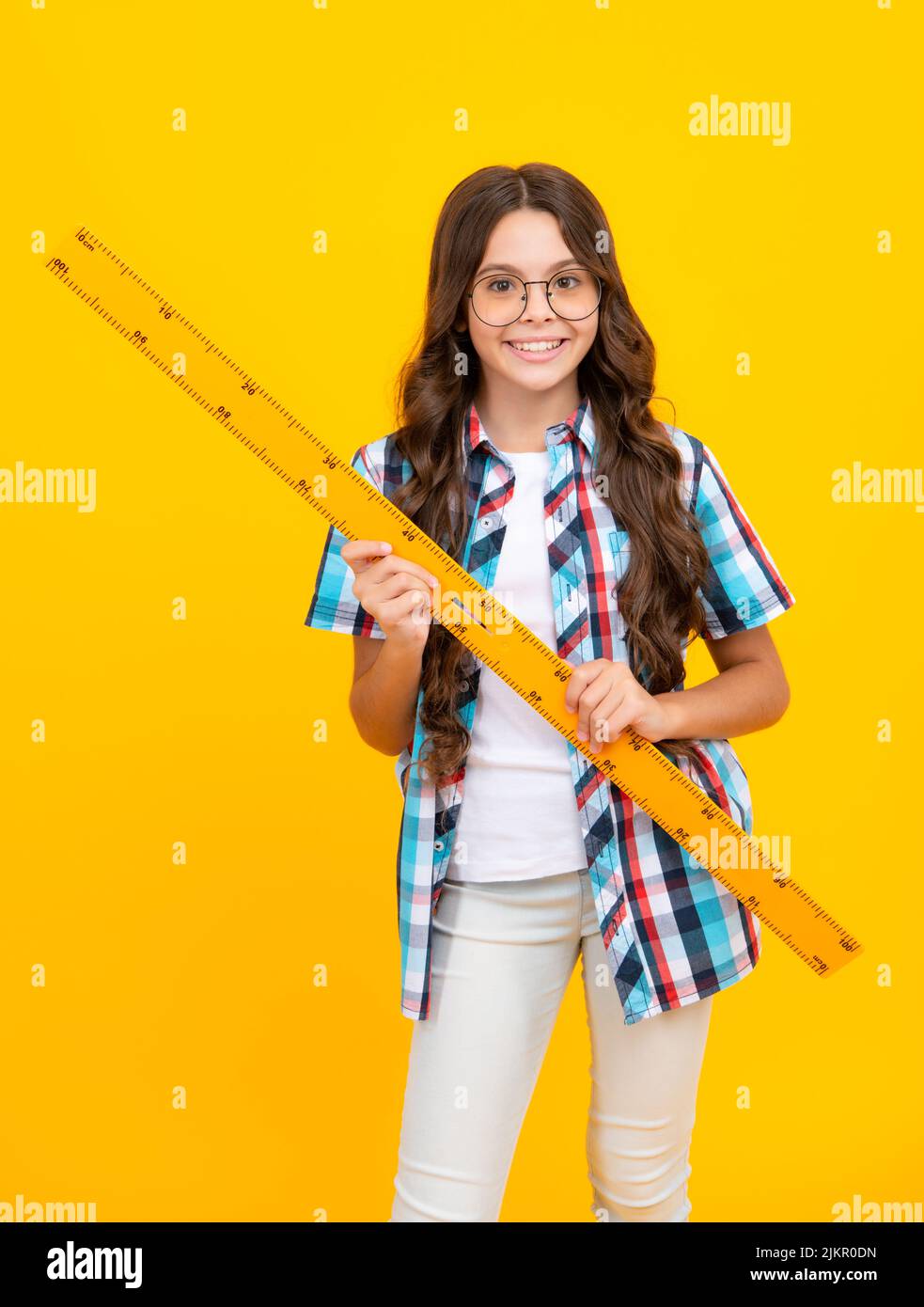 Teenager child school girl holding measure for geometry lesson ...
