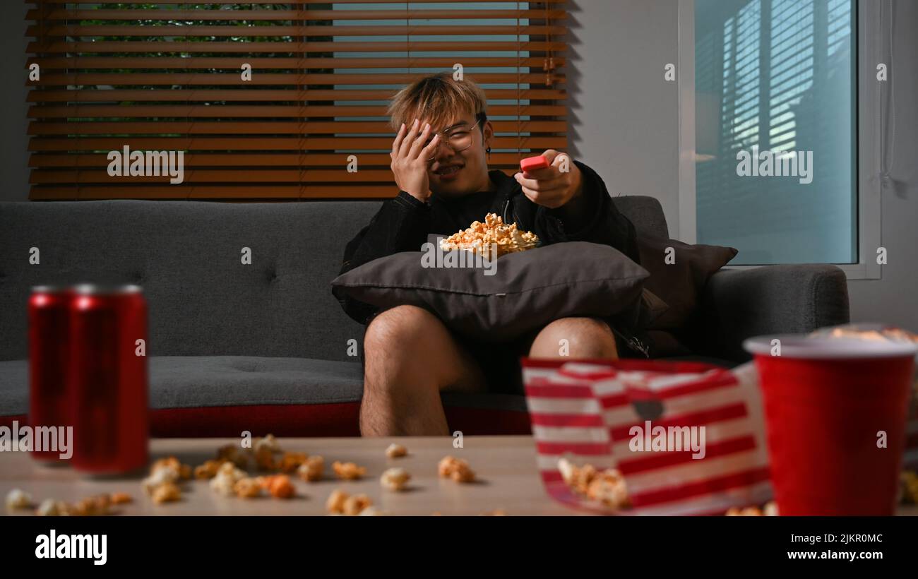 Asian watching tv horror hi-res stock photography and images - Alamy
