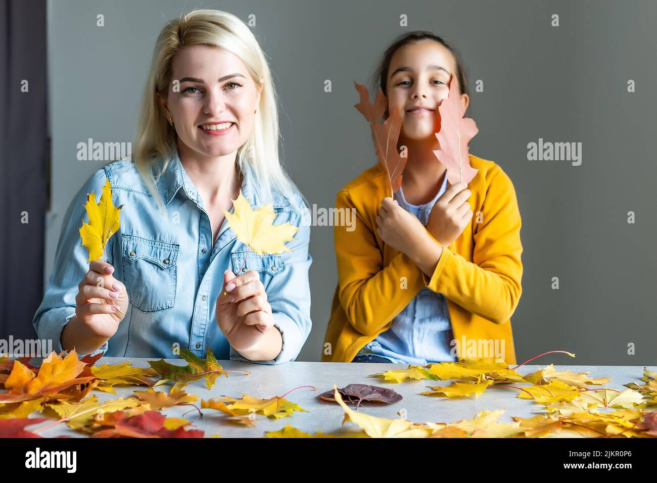 Happy family doing autumn decor. Fall atmosphere Stock Photo - Alamy