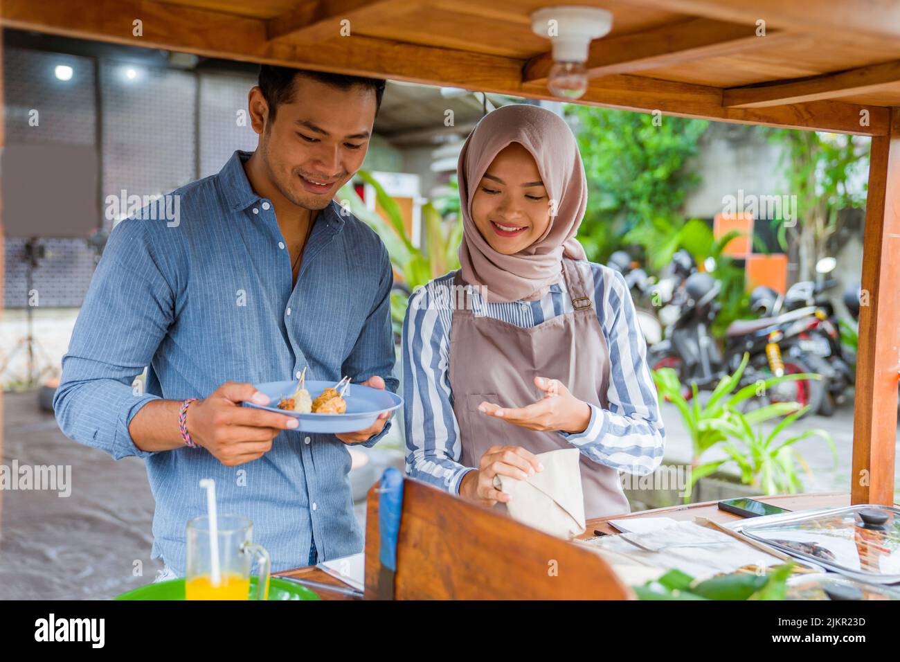 customer picking an order in traditional food market stall Stock Photo ...