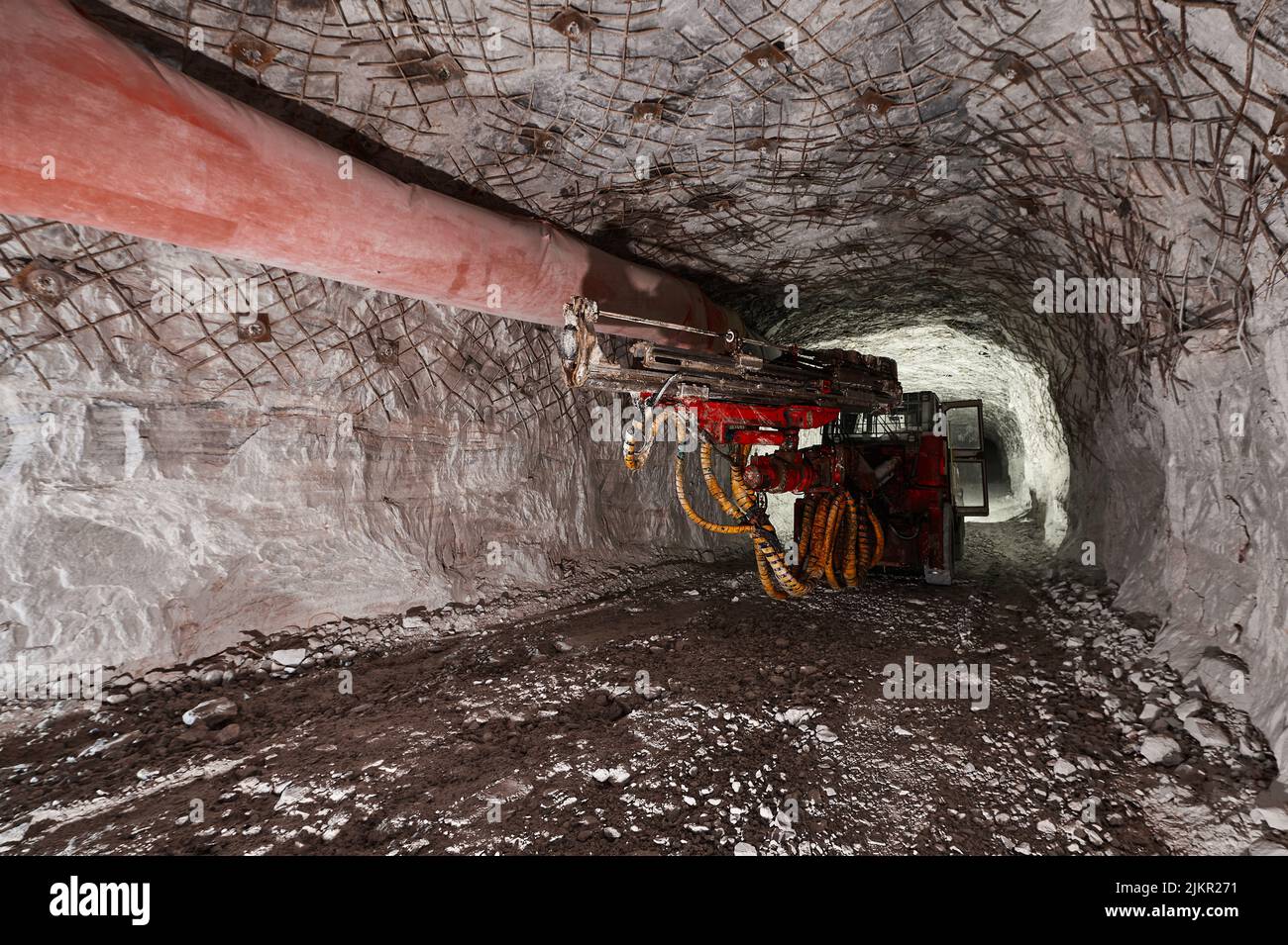 Mining drilling machine works in tunnel of salt quarry Stock Photo - Alamy