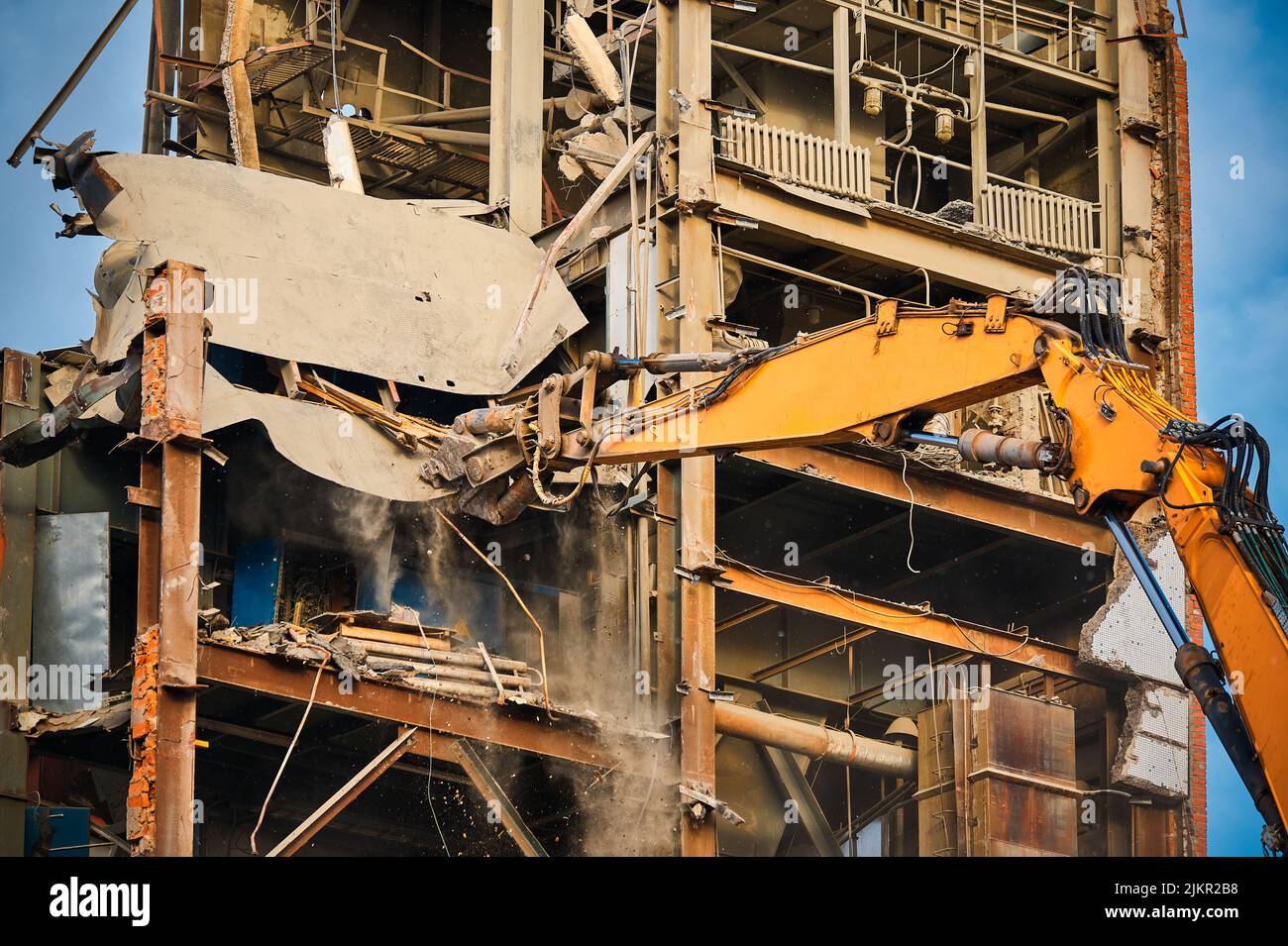 Destroying of old industrial building by excavator destroyer Stock ...