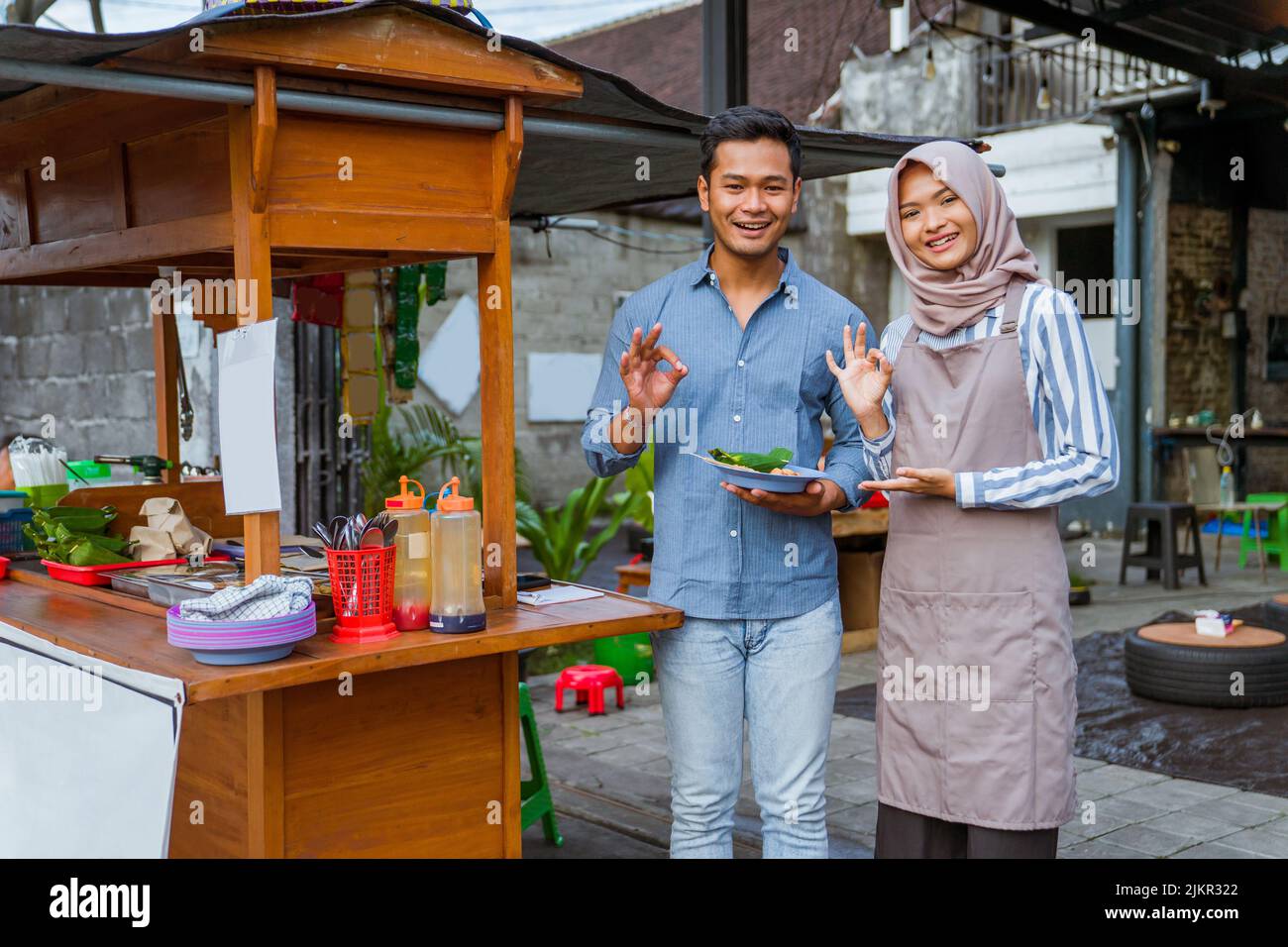 muslim couple ordering food to break fasting in ramadan Stock Photo - Alamy