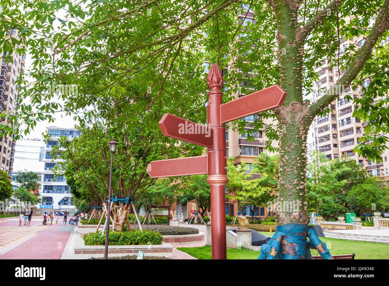 Close-up of directional street signs in residential building complex ...