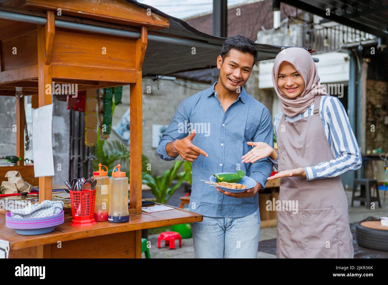 muslim couple ordering food to break fasting in ramadan Stock Photo - Alamy