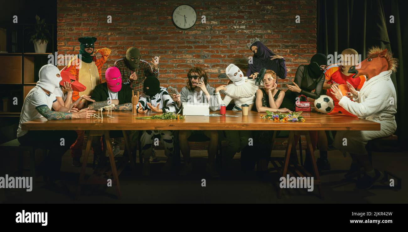 Group of people standing, sitting at the long table in different ...