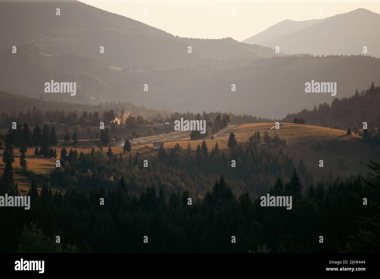 Magic summer sunset over the mountain village at Tihuta, Piatra ...