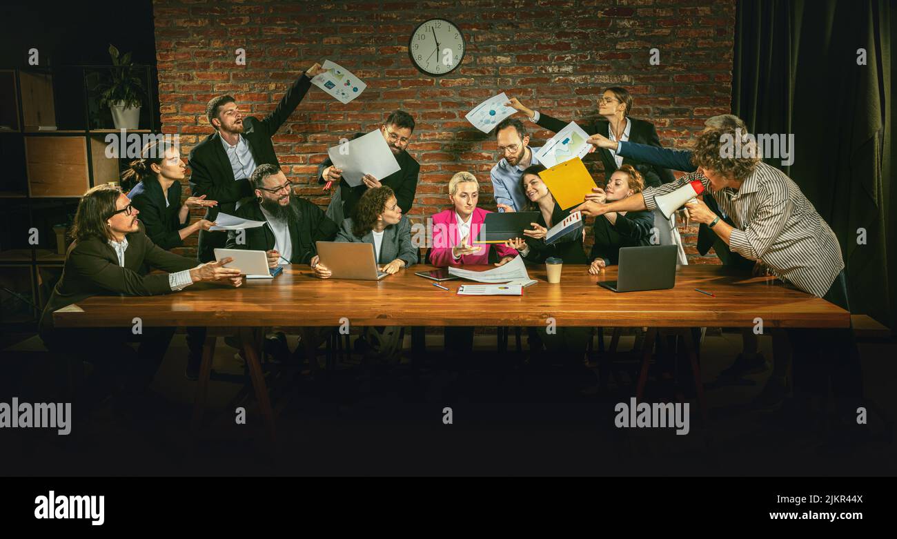 Active, motivated employees giving graphs to office manager. Successful ...