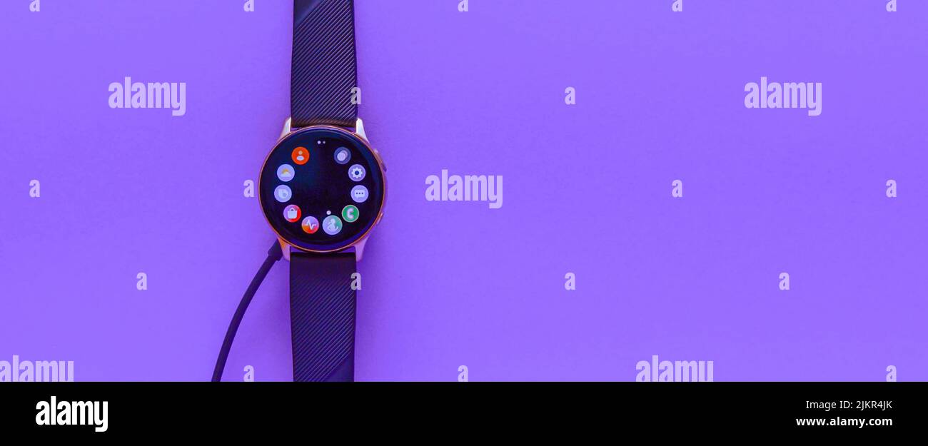 Smartwatch charging.Smart watch on wireless charging with on-screen ...