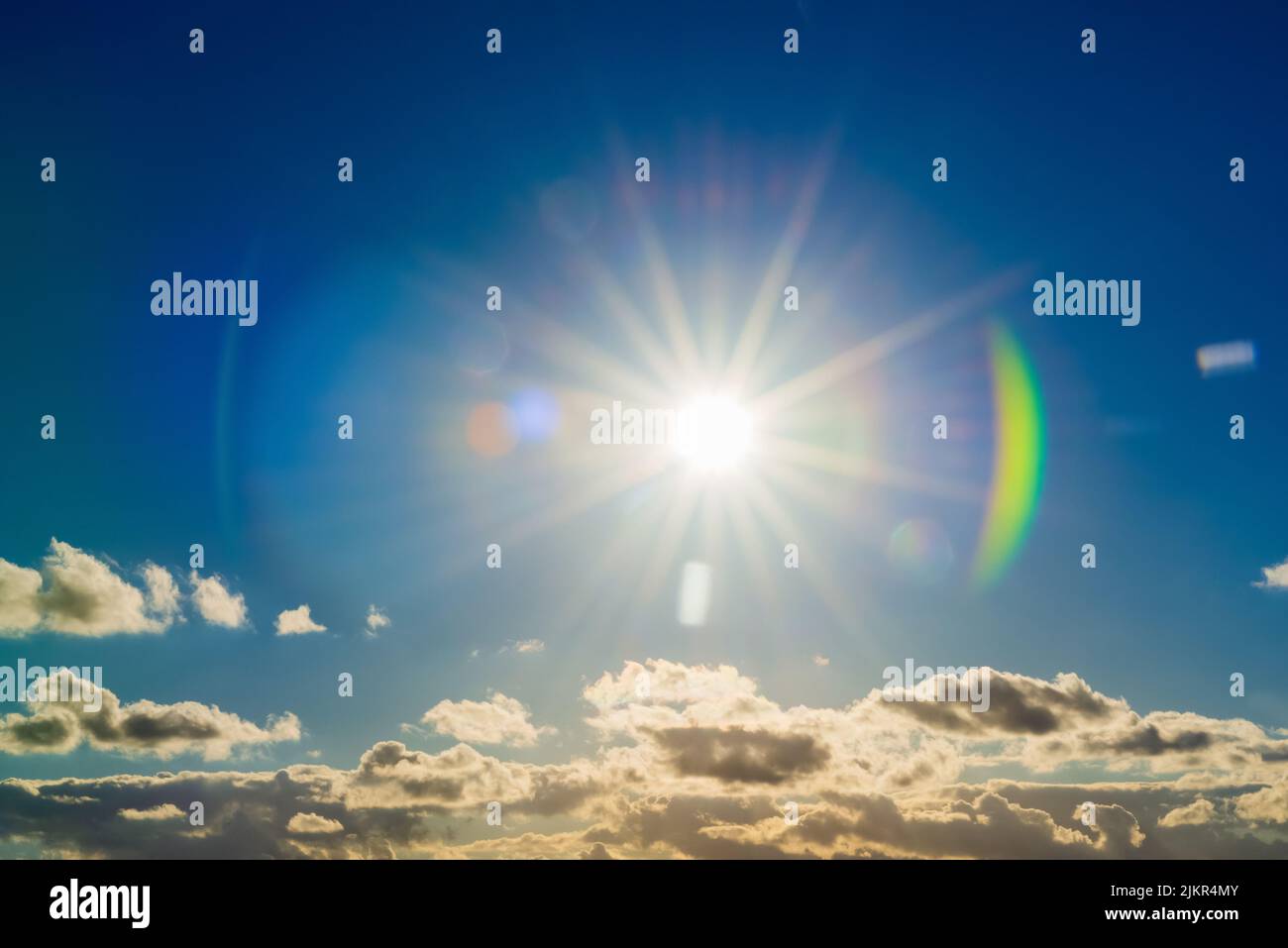 Sunset abstract blue sky, bright sun shines through clouds.Nice sunset ...