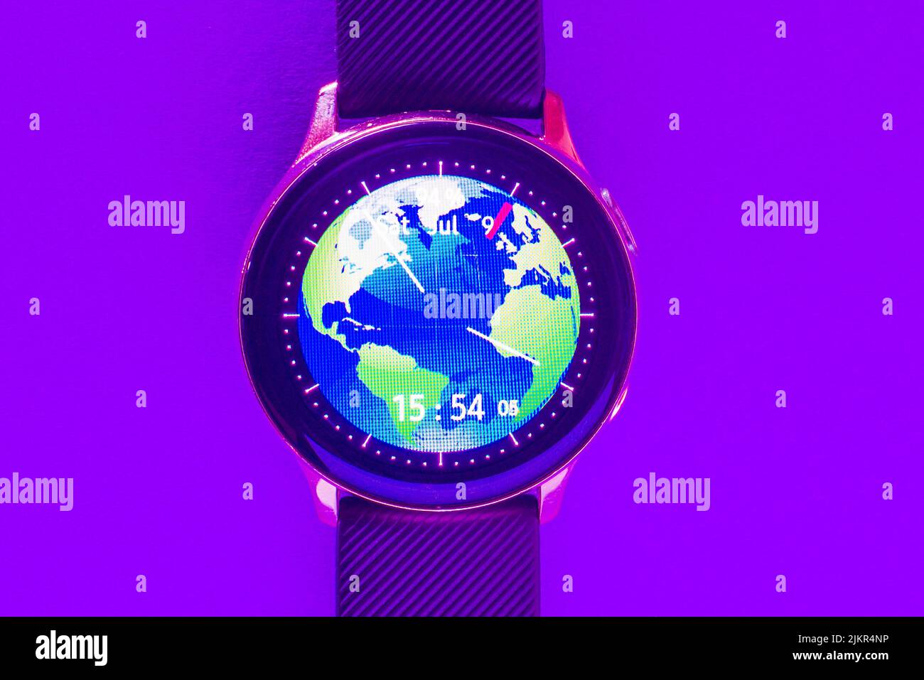 Smart watch on the glowing neon purple,veri peri color background ...