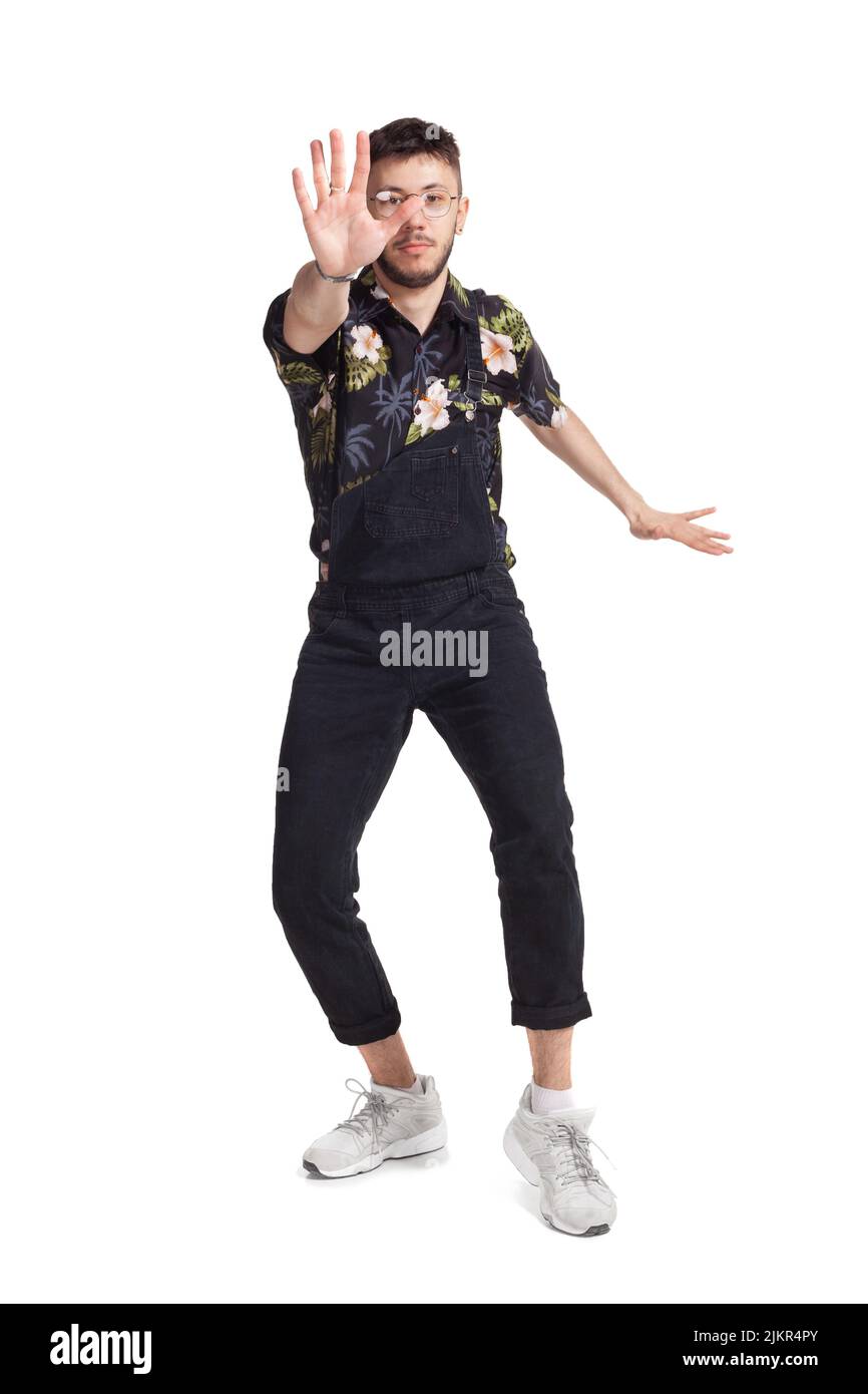 Full-length portrait of a funny guy dancing in studio isolated on white ...