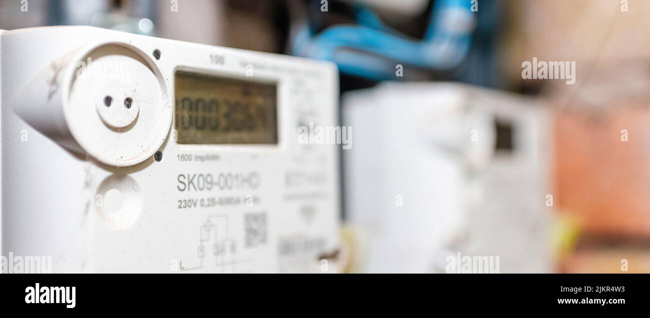 Two smart electric power meter counter measuring power usage.Banner ...