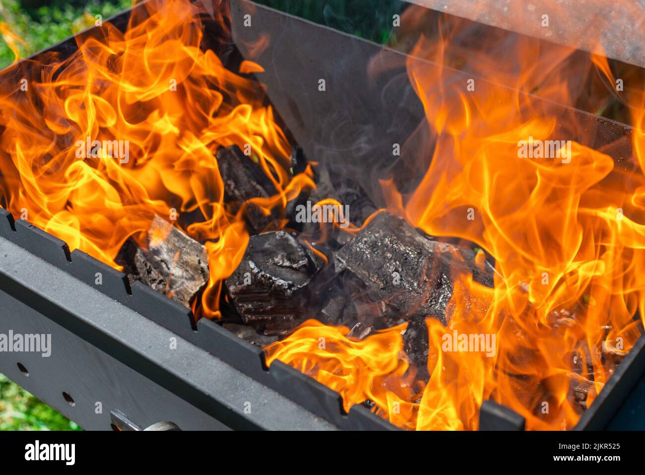 Burning flame of wood fire in the outdoor.shashlik bakery in summer ...