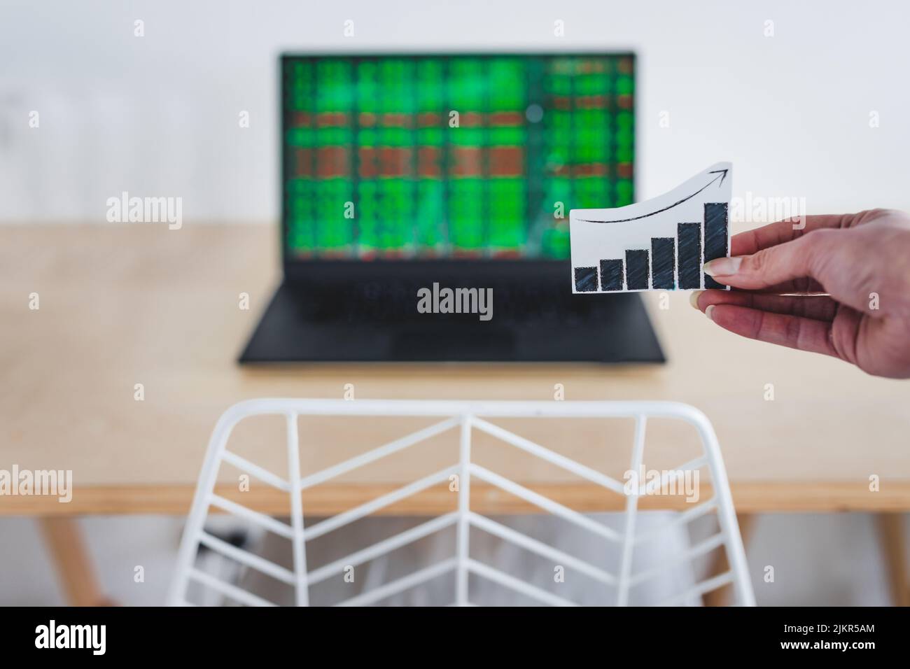 concept of trading stocks online, chart with stats going up text in ...