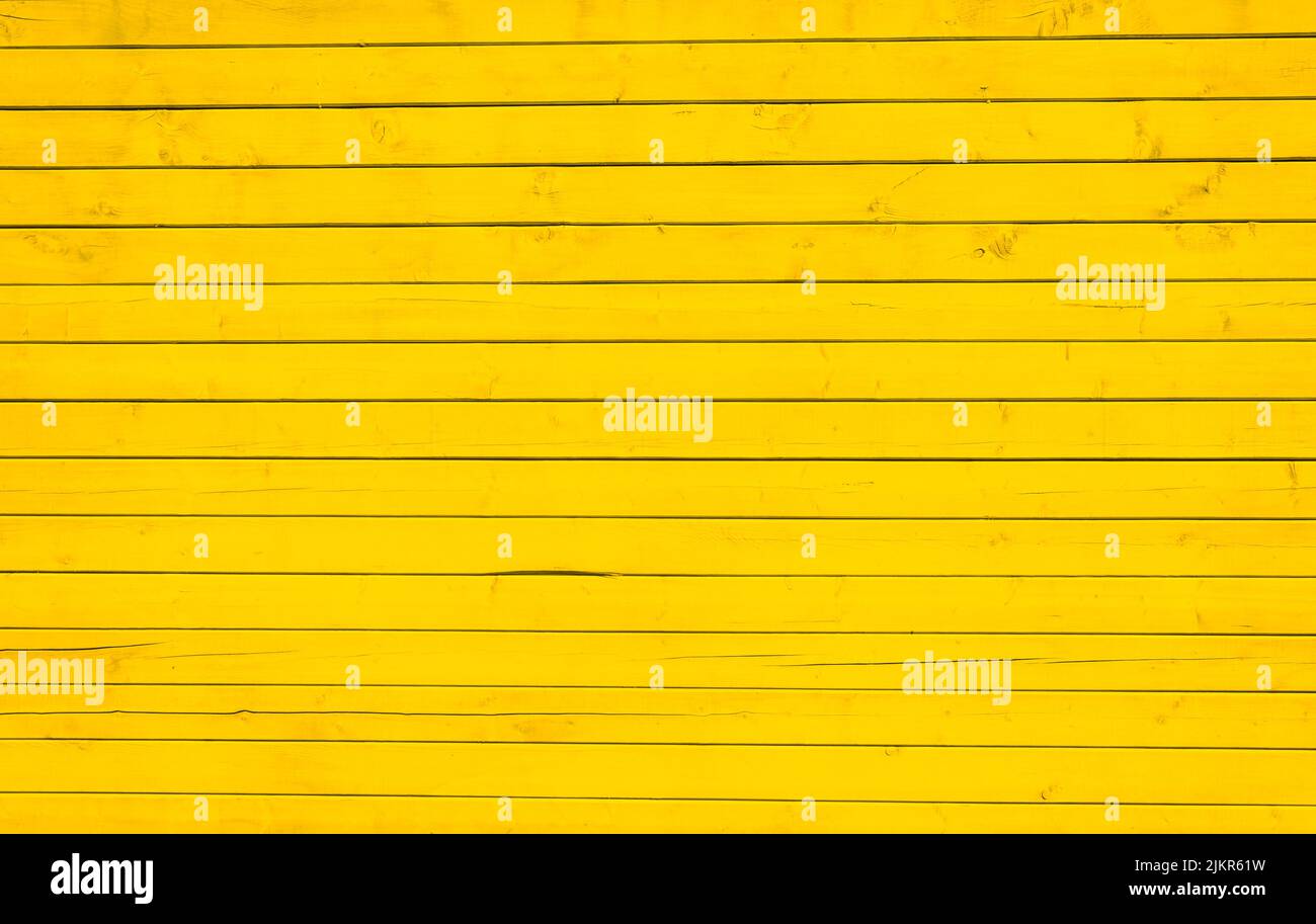 Surface of wooden boards painted with yellow paint. Background Texture ...