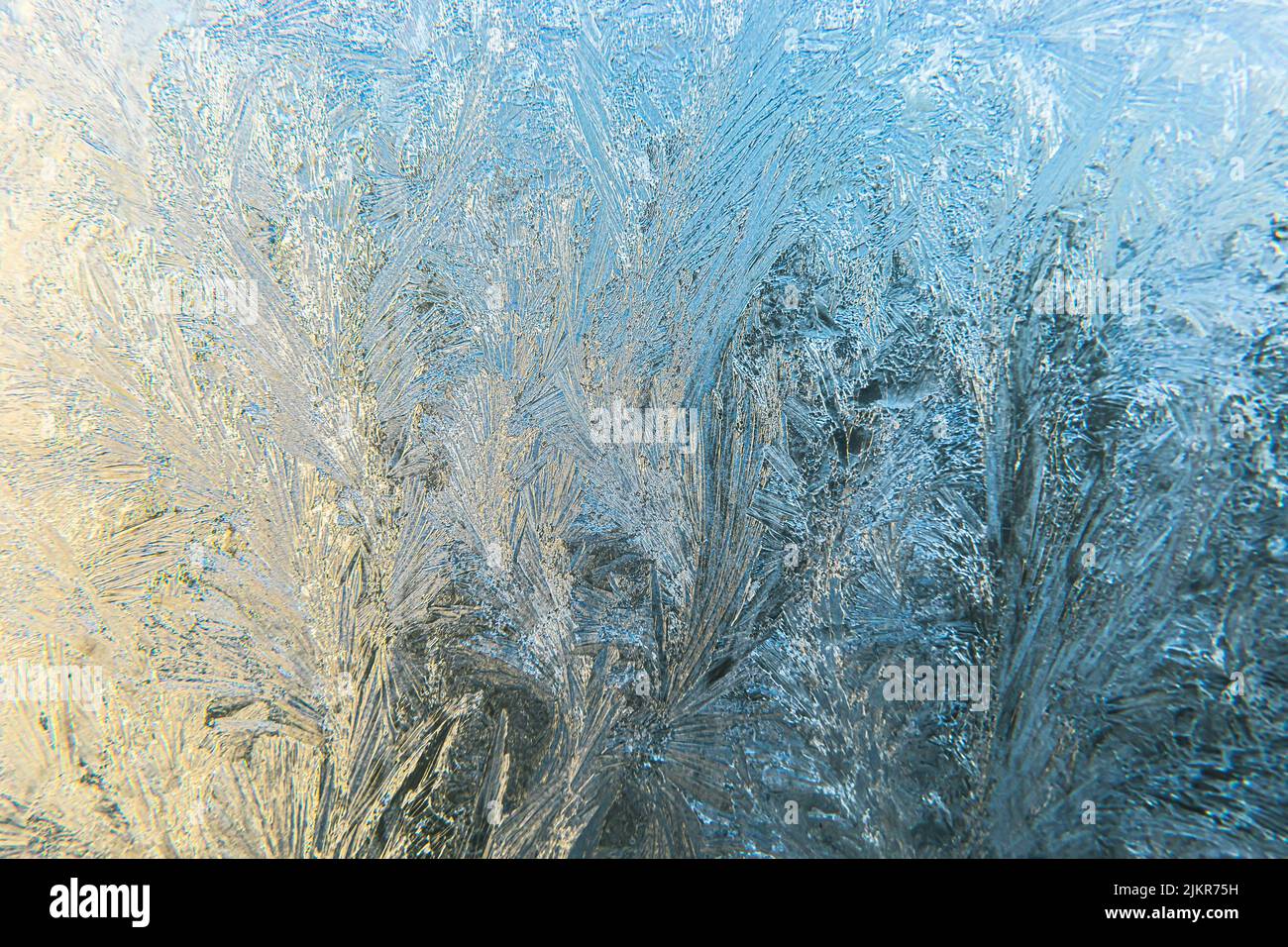 Frozen winter window with shiny ice frost pattern texture. Christmas ...
