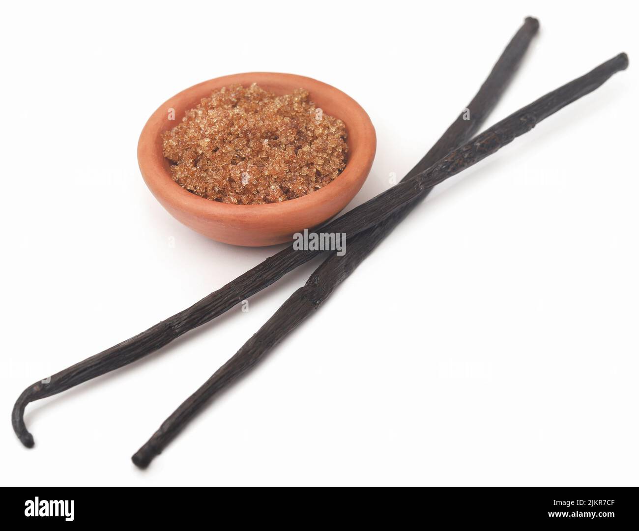Vanilla pods with brown sugar isolated over white background Stock ...