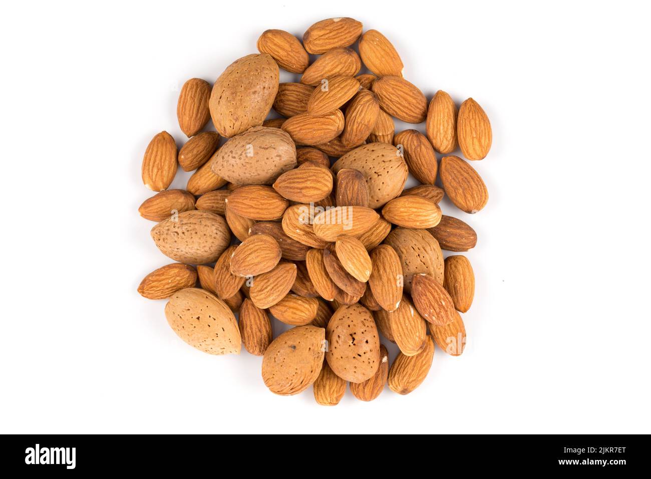 Pile of almonds nuts on a white background Stock Photo - Alamy