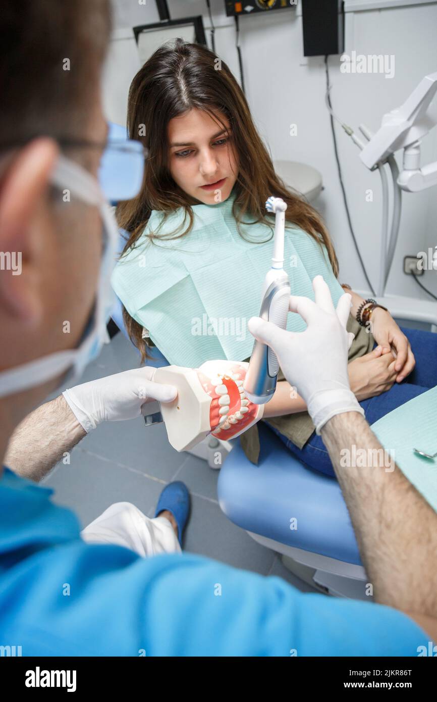 Professional doctor demonstration process of healthy teeth brushing to ...
