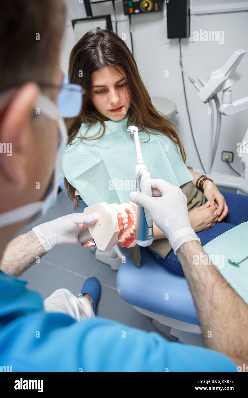 Professional doctor demonstration process of healthy teeth brushing to ...