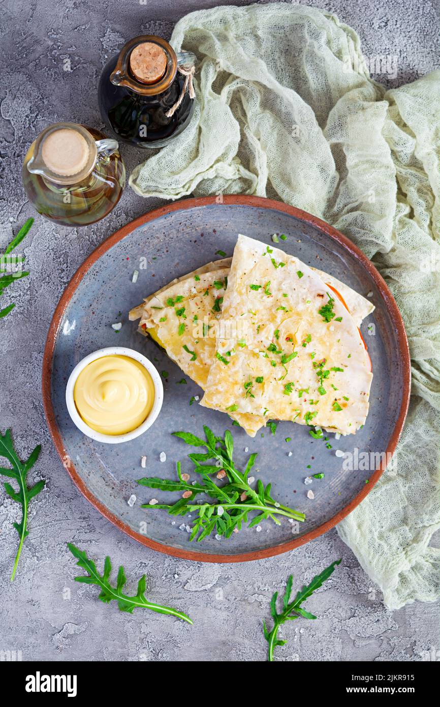Fried pita bread with scrambled eggs, tomatoes, meat and cheese ...