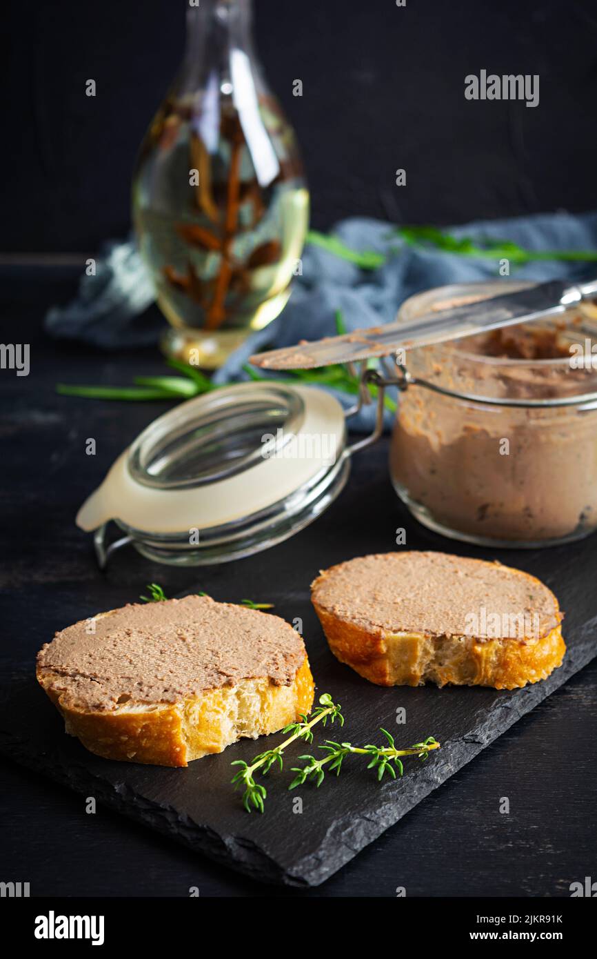 Sandwich with chicken liver pate on dark background Stock Photo - Alamy