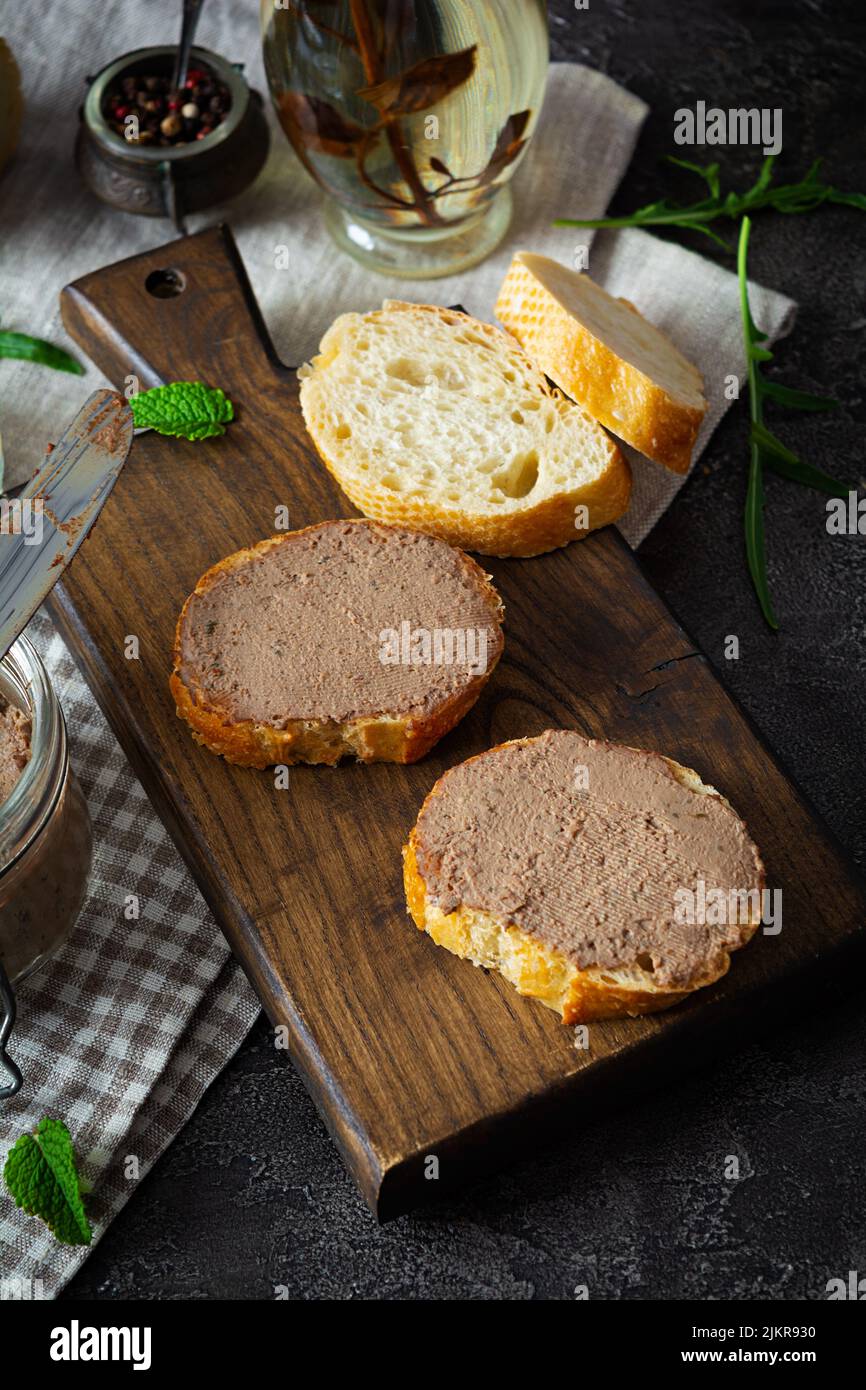 Sandwich with chicken liver pate on dark background Stock Photo - Alamy