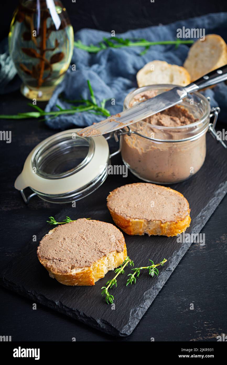 Sandwich with chicken liver pate on dark background Stock Photo - Alamy