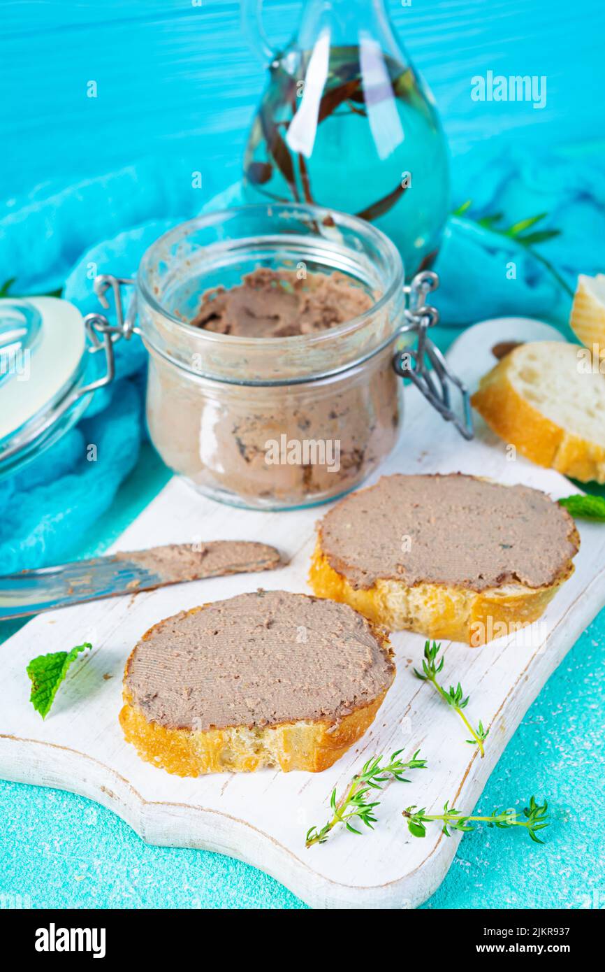 Sandwich with chicken liver pate on blue background Stock Photo - Alamy