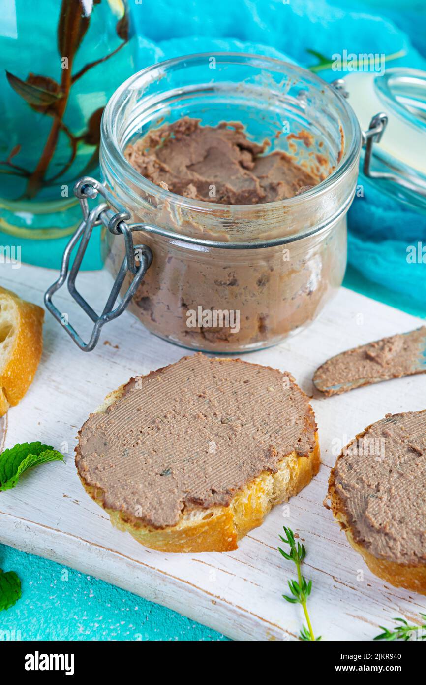 Sandwich with chicken liver pate on blue background Stock Photo - Alamy